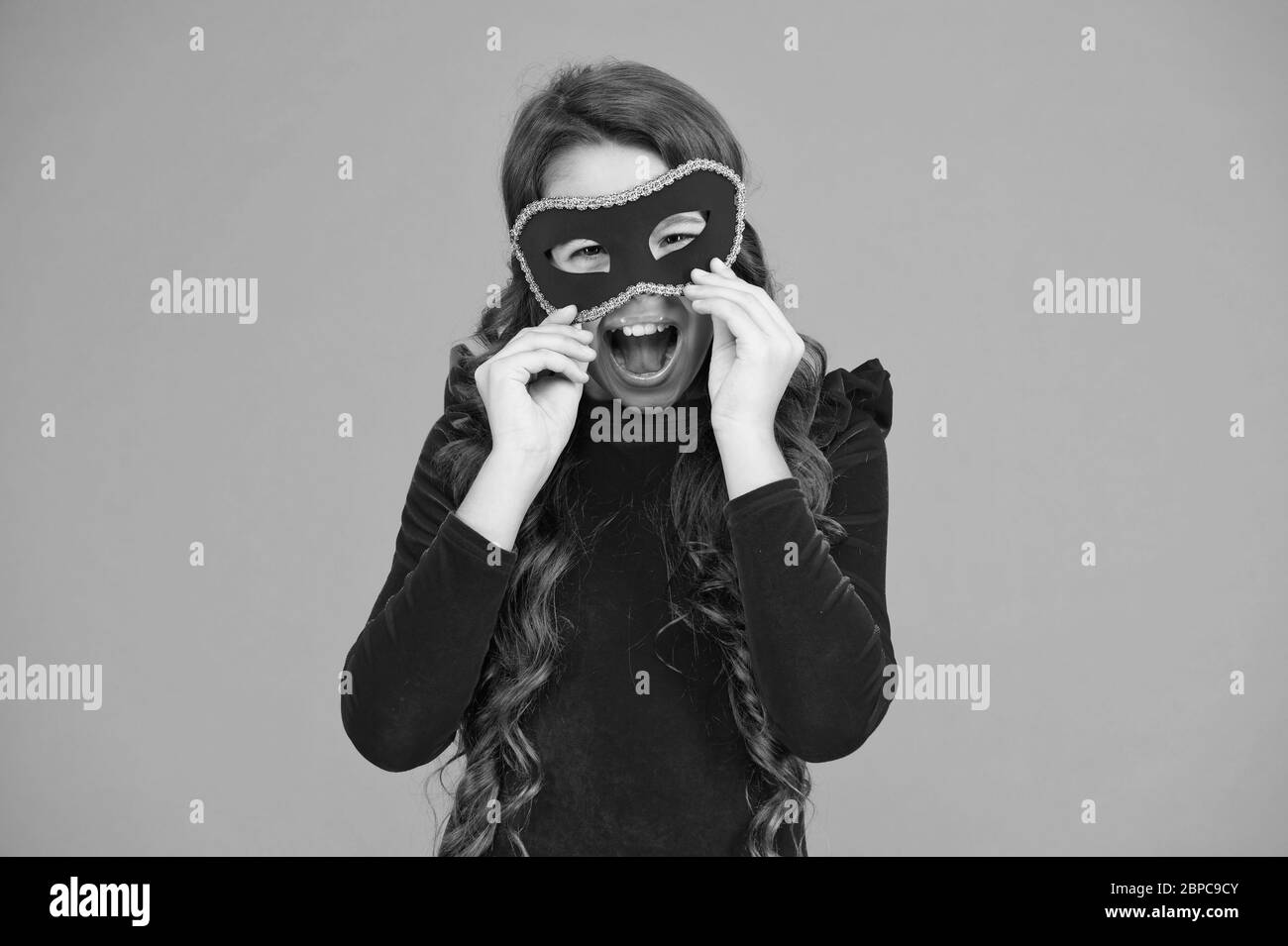 Happy new year. Happy girl wear eye mask. Little child enjoy new year ...