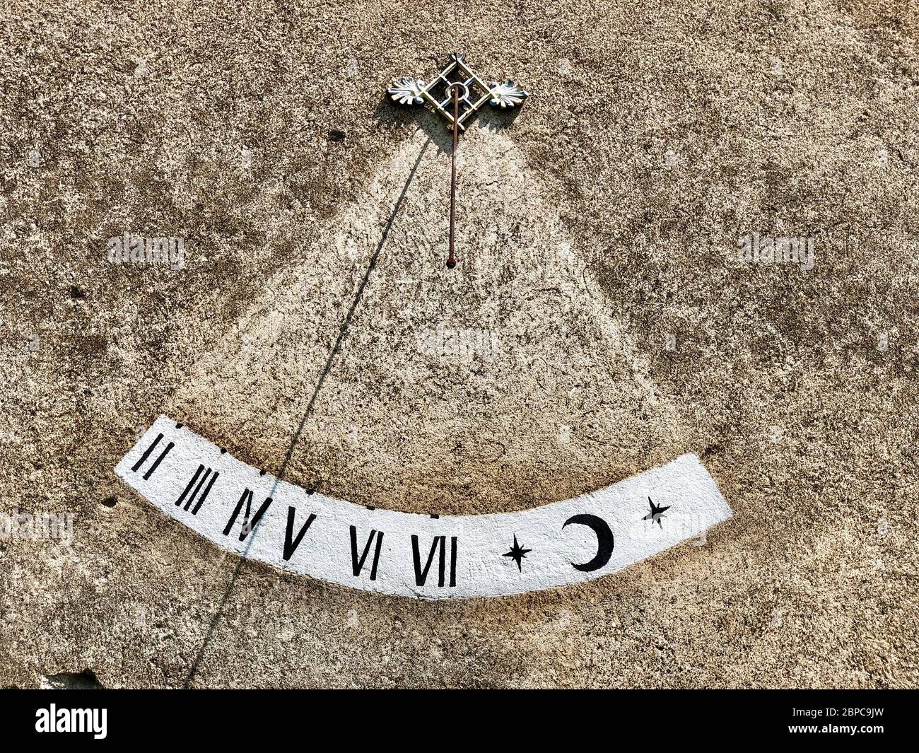 Detail of Sundial clock on concrete wall Stock Photo - Alamy