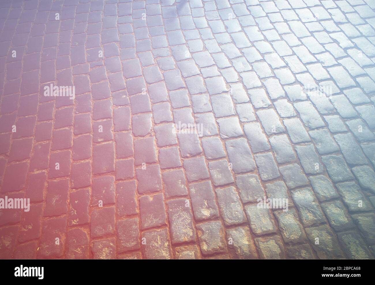 Minimalistic rock street pavement during sunset time Stock Photo - Alamy