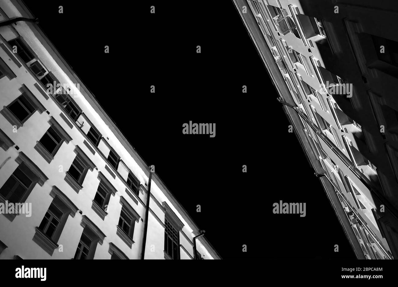Black & white diagonal buildings upward view background Stock Photo - Alamy