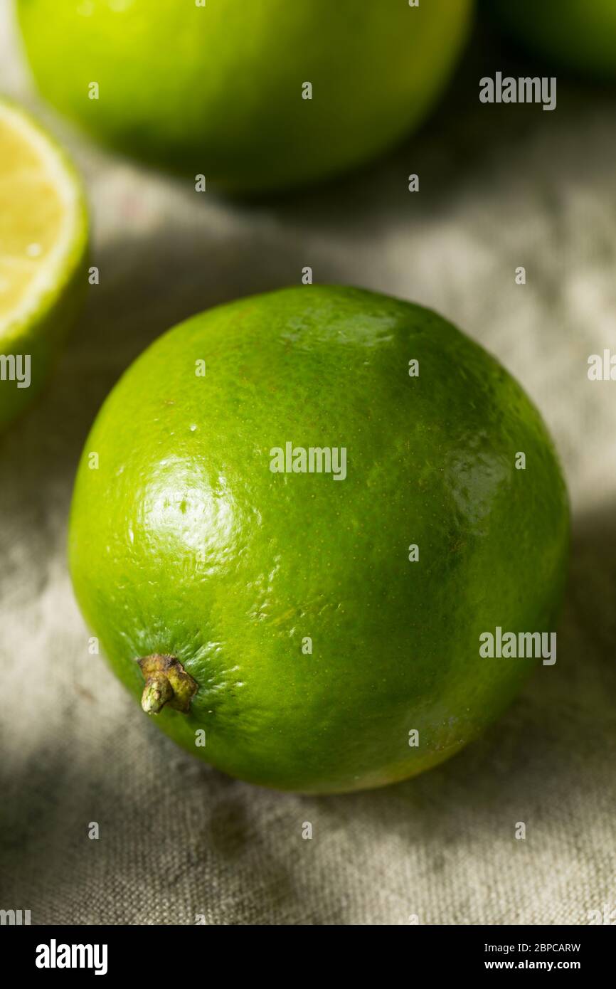 Raw Organic Green Limes in a bunch Stock Photo - Alamy