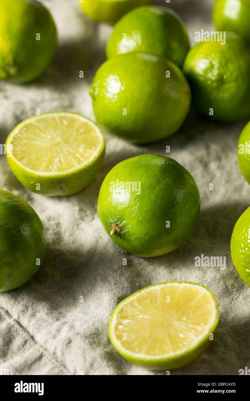 Raw Organic Green Limes in a bunch Stock Photo - Alamy