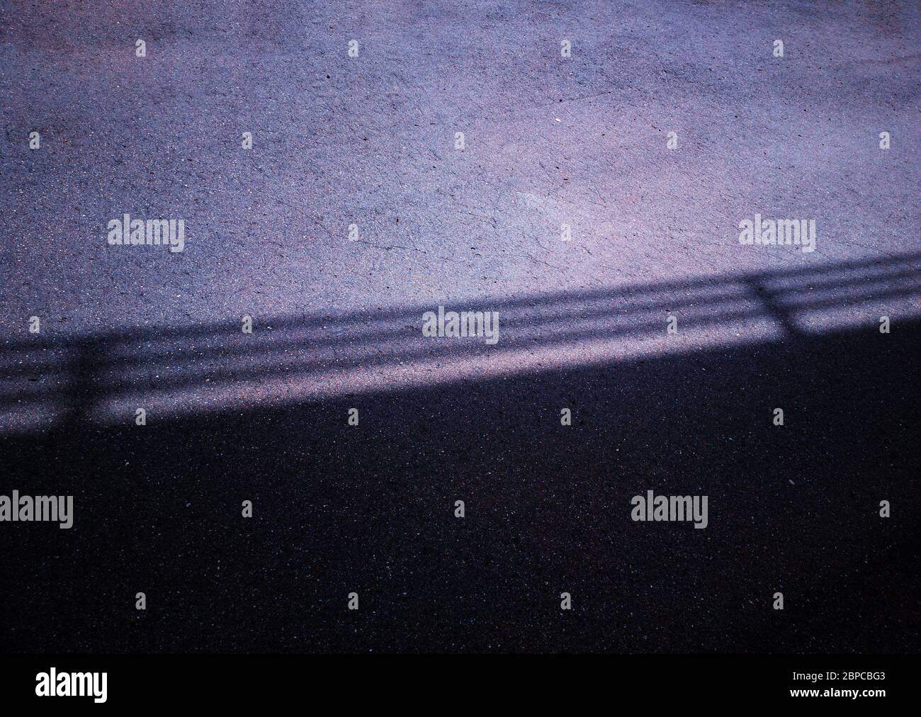 Shadow from the speed border road background Stock Photo - Alamy