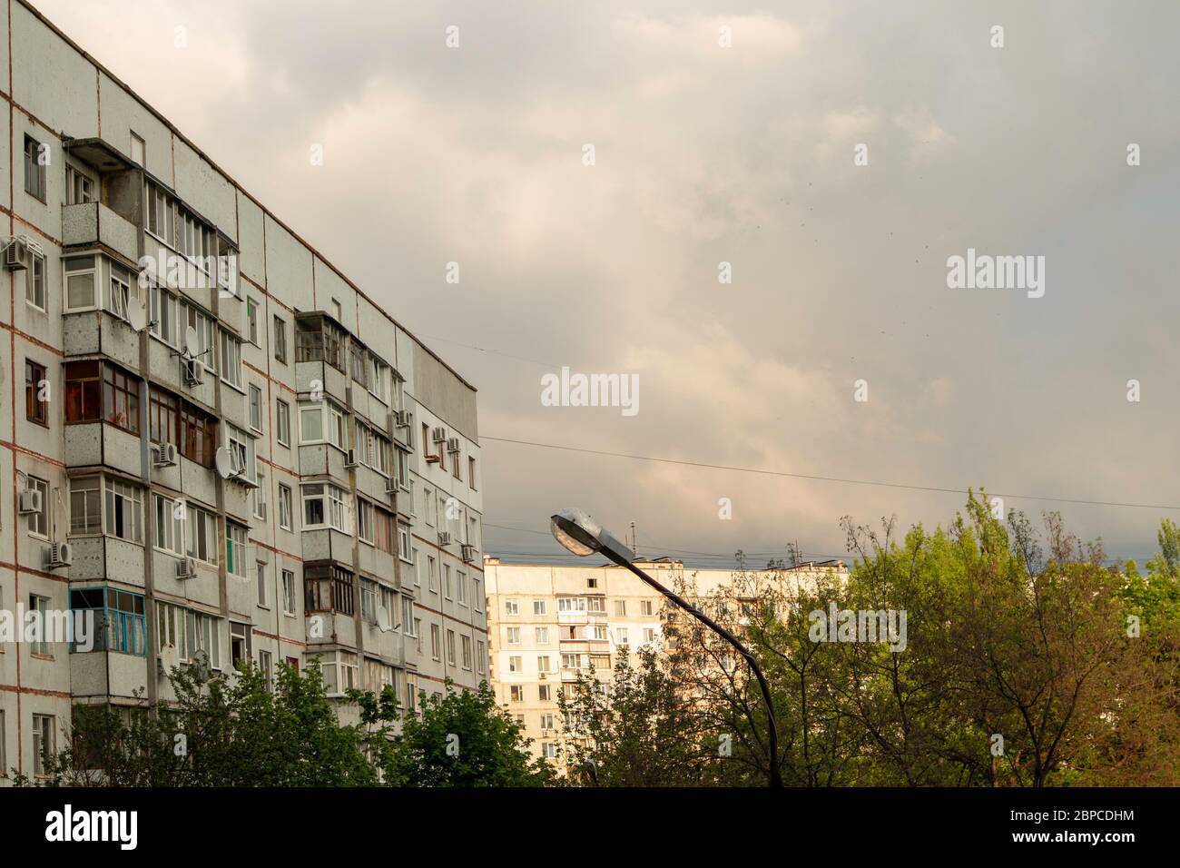 Soviet panel houses before the storm. Clouds over multistory houses ...