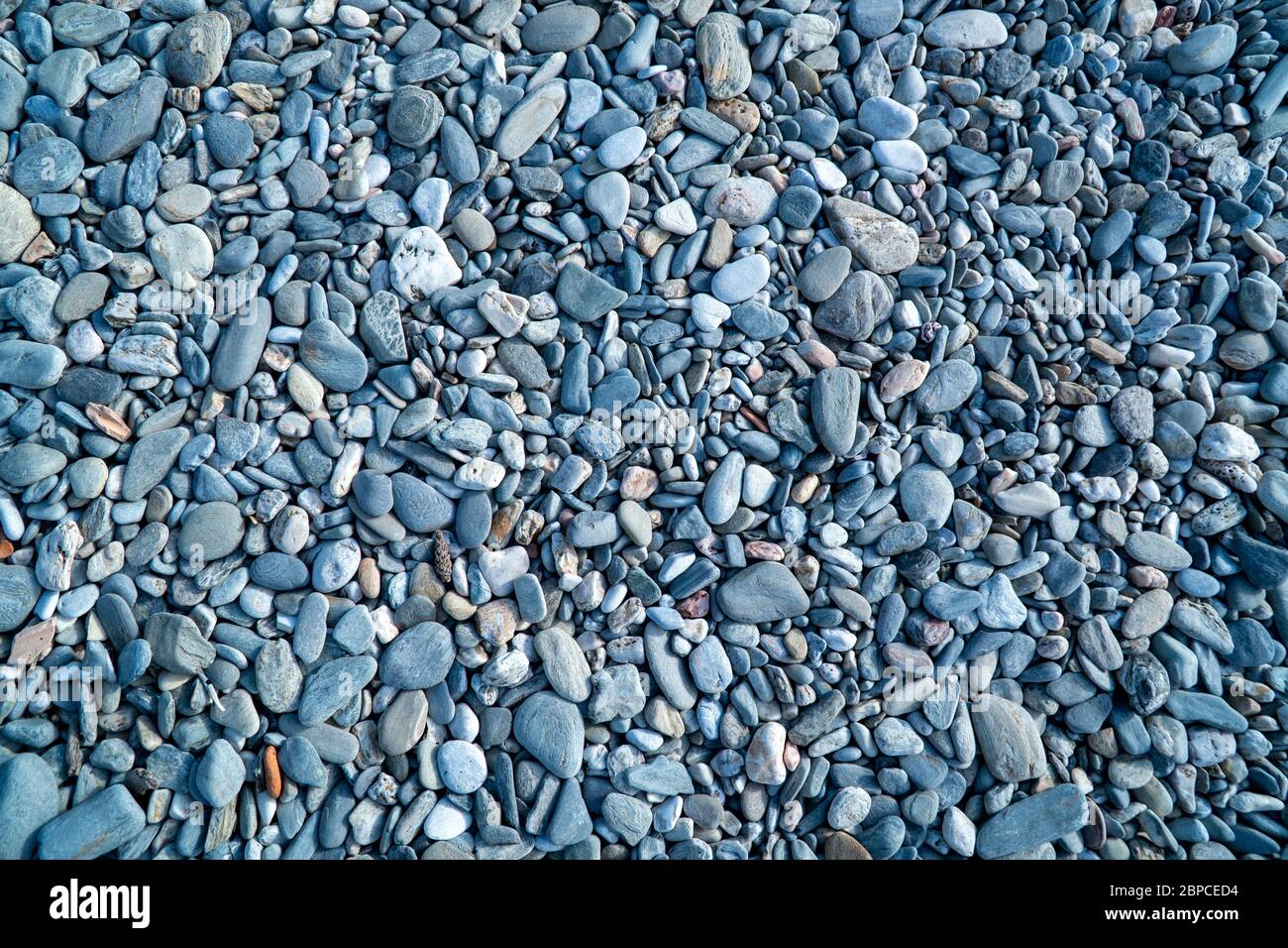 Blue pebbles. Background from a natural stone of blue, turquoise hue ...