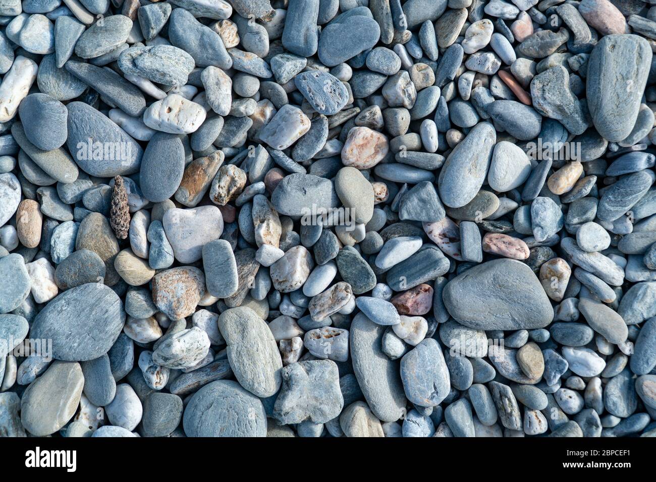 Blue pebbles closeup. Blue pebbles. Background from a natural stone of ...