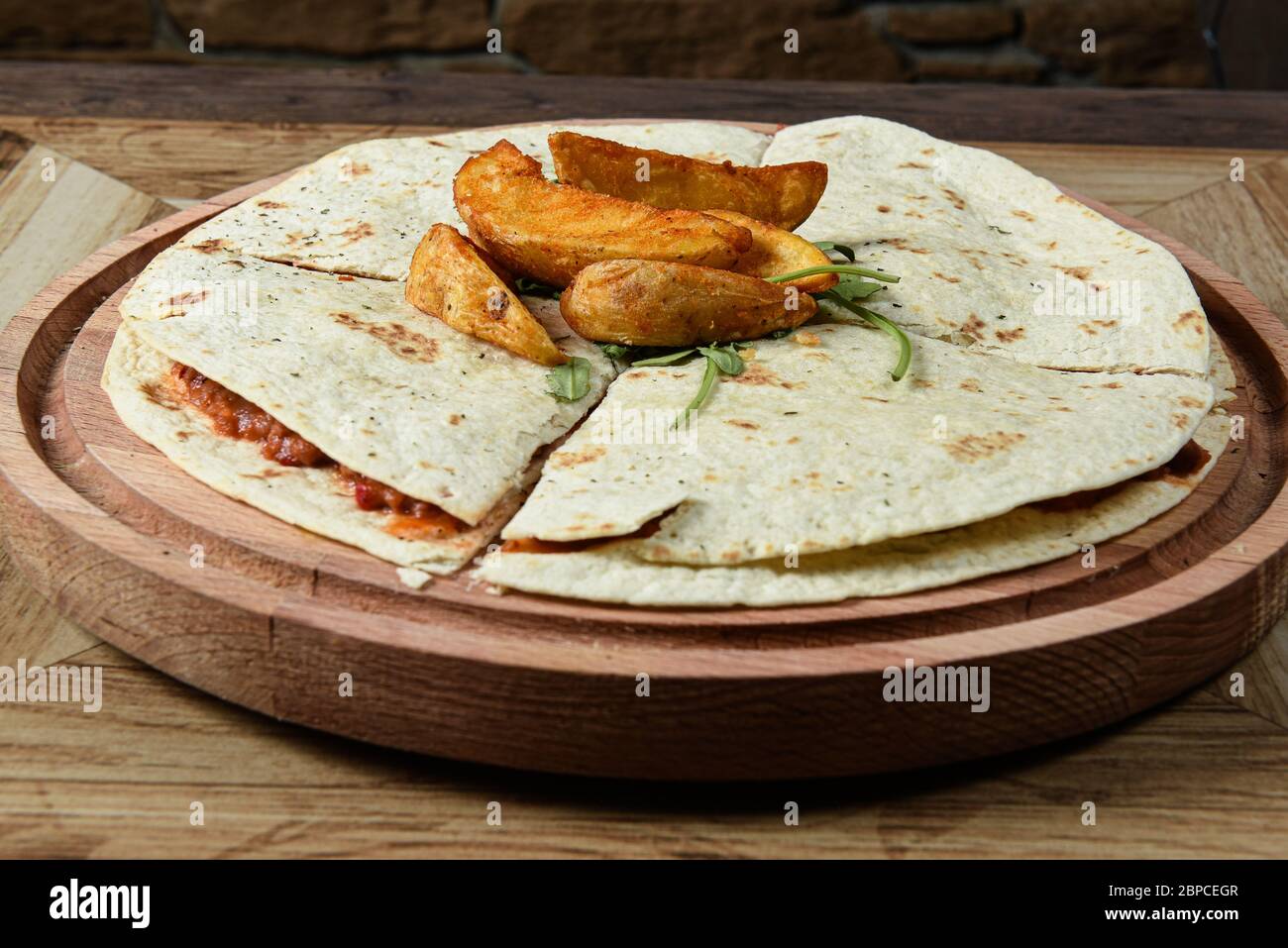 Wooden plank served sandwich pizza Stock Photo - Alamy