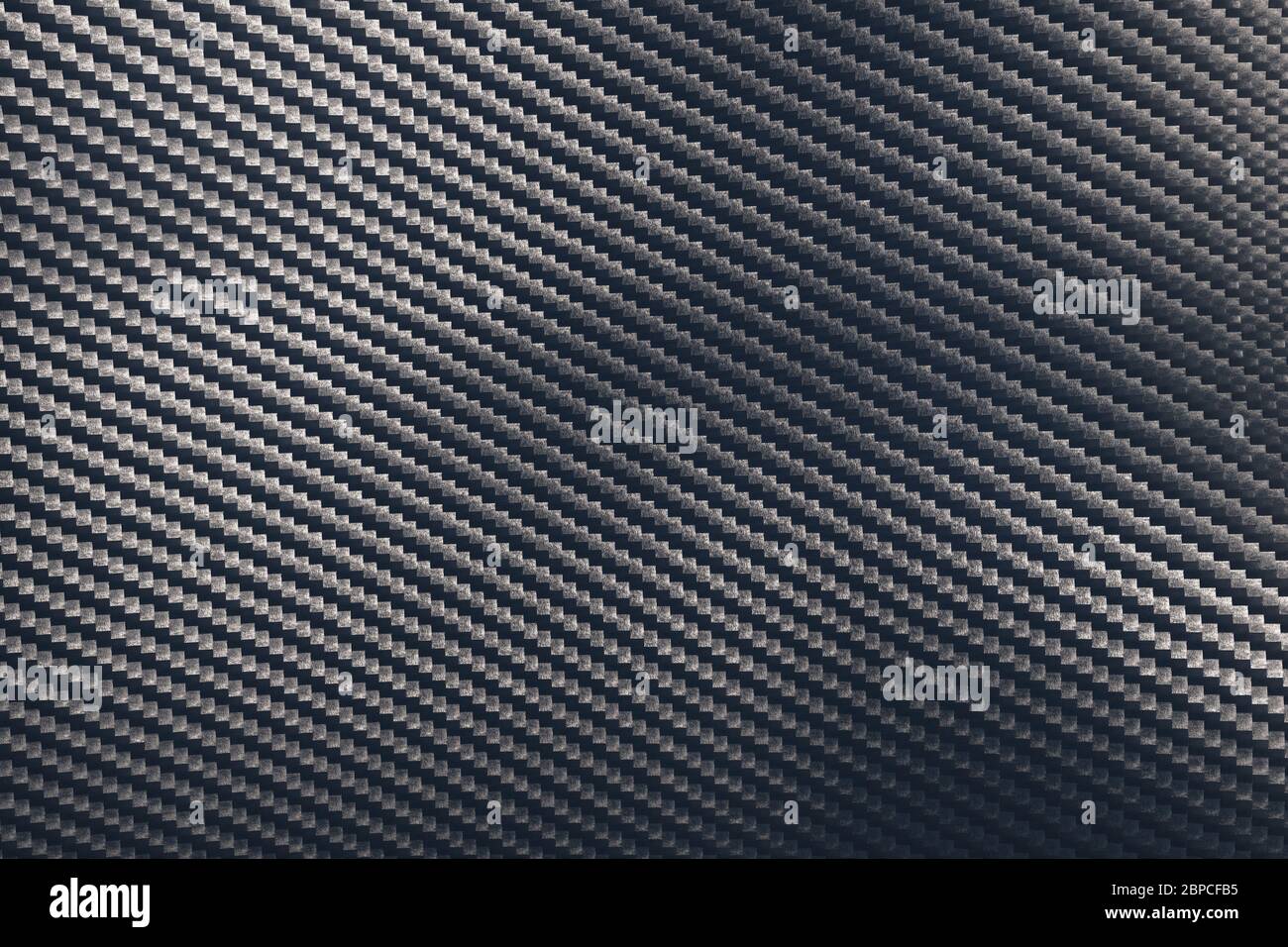 carbon fibre or graphite sheet with background texture beam of light ...