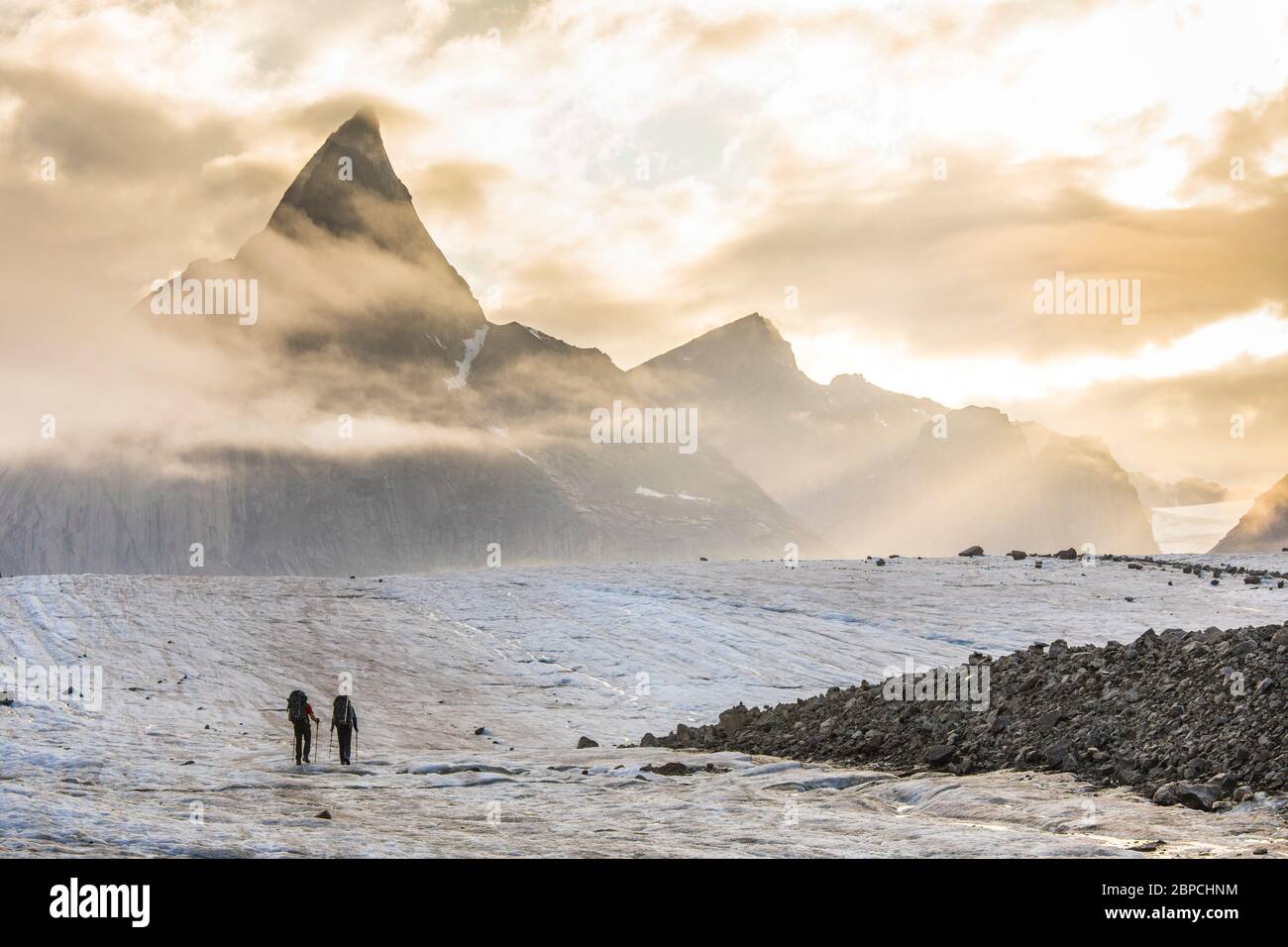 Rear view of silhouetted climbers en route to Mt. Loki Stock Photo - Alamy