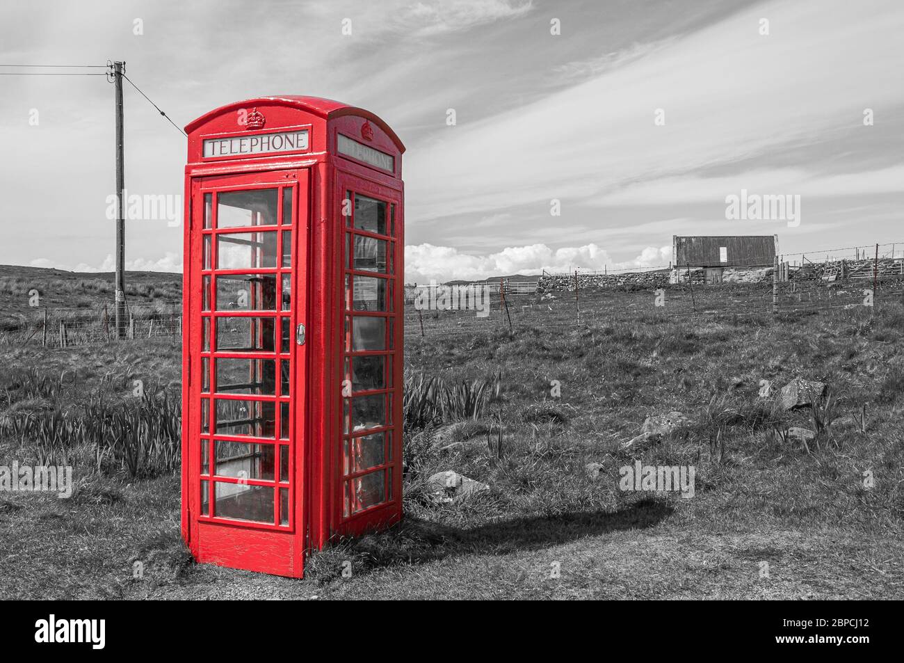 Isolated red telephone booth color isolation effect Stock Photo - Alamy