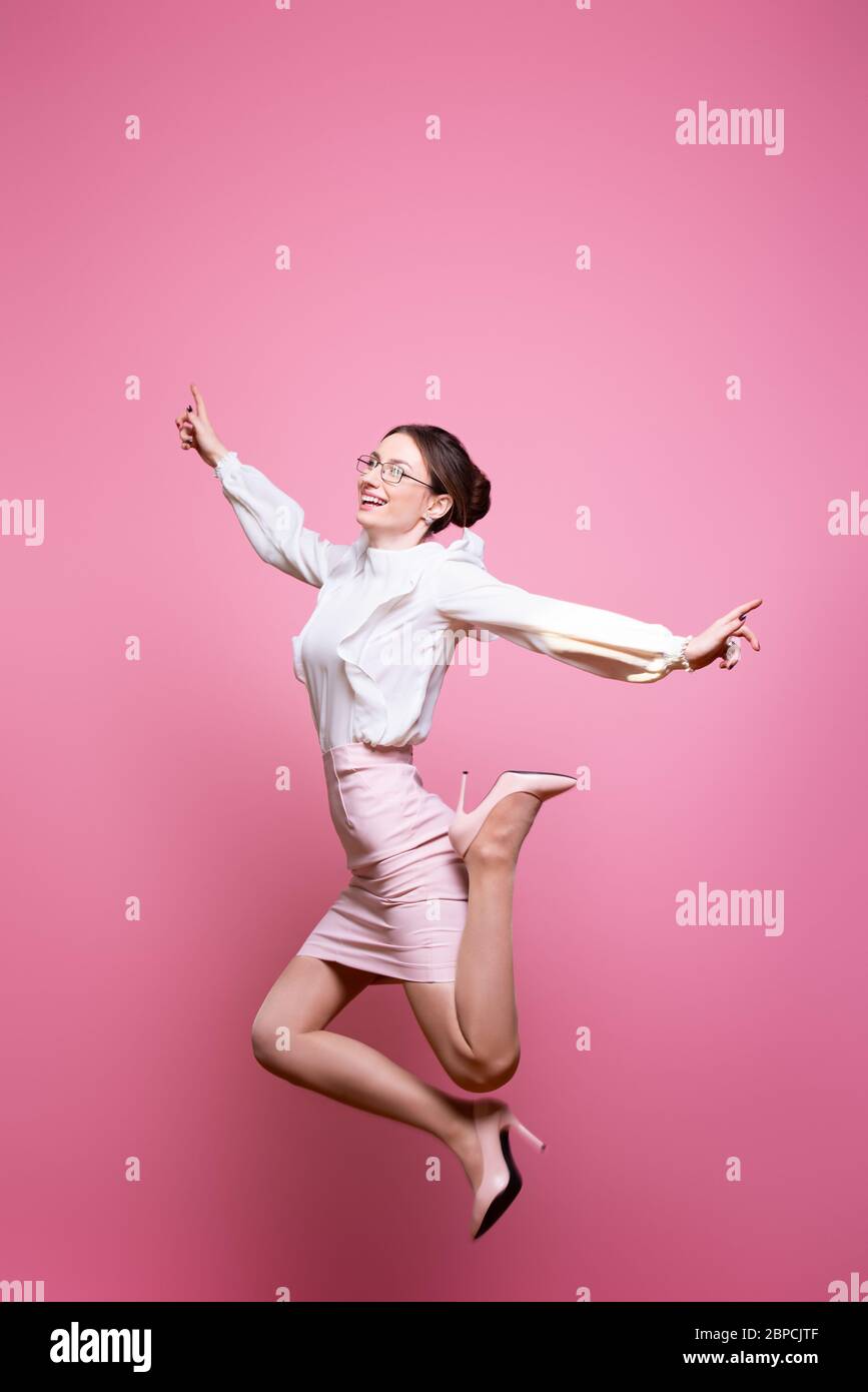 Beautiful female student jumping hi-res stock photography and images ...