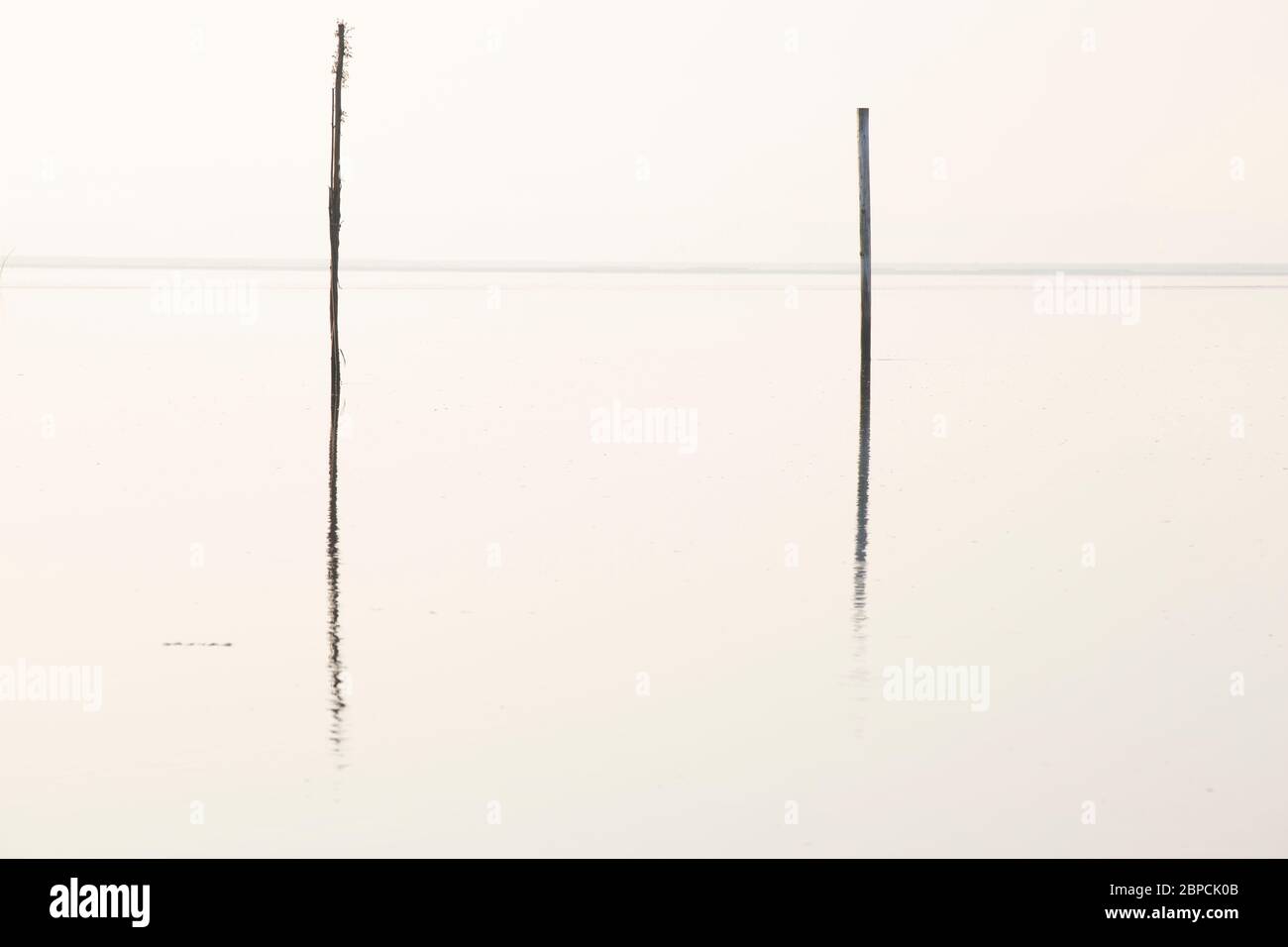 stilt wooden port for old boats in hight key Stock Photo - Alamy