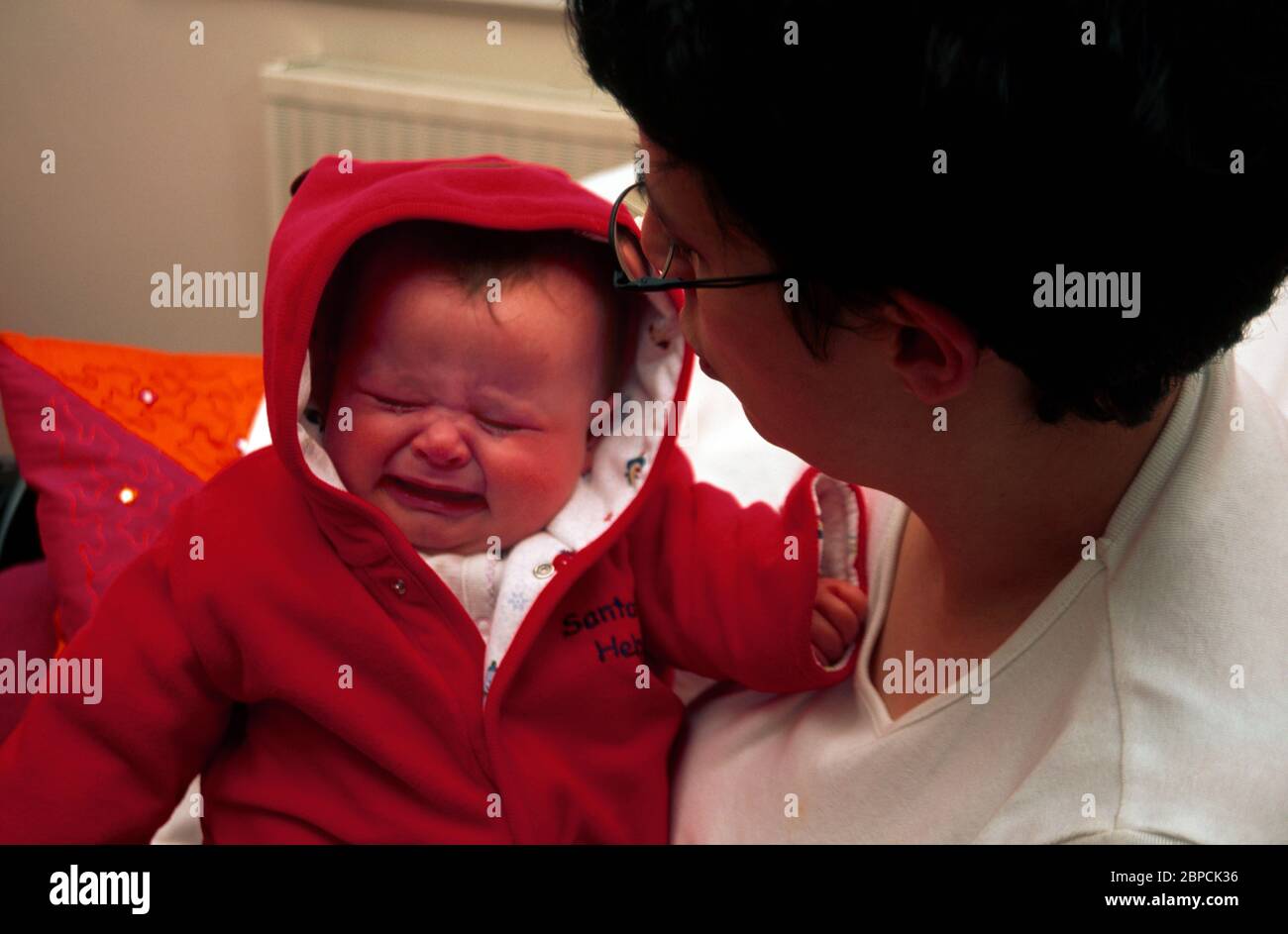 Mother trying to comfort Baby Daughter Stock Photo - Alamy