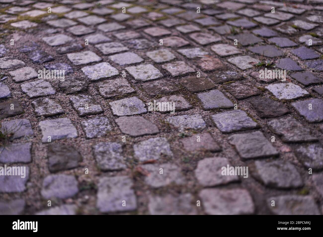 Paving stone street in an old town in Europe stones structure pattern ...