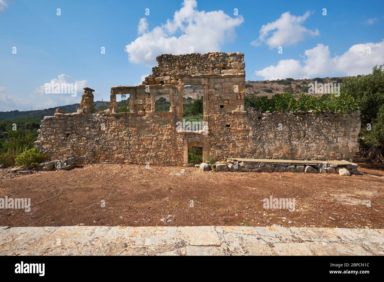Abandoned wild stone ruins of an old ancient monastery in rural Crete ...