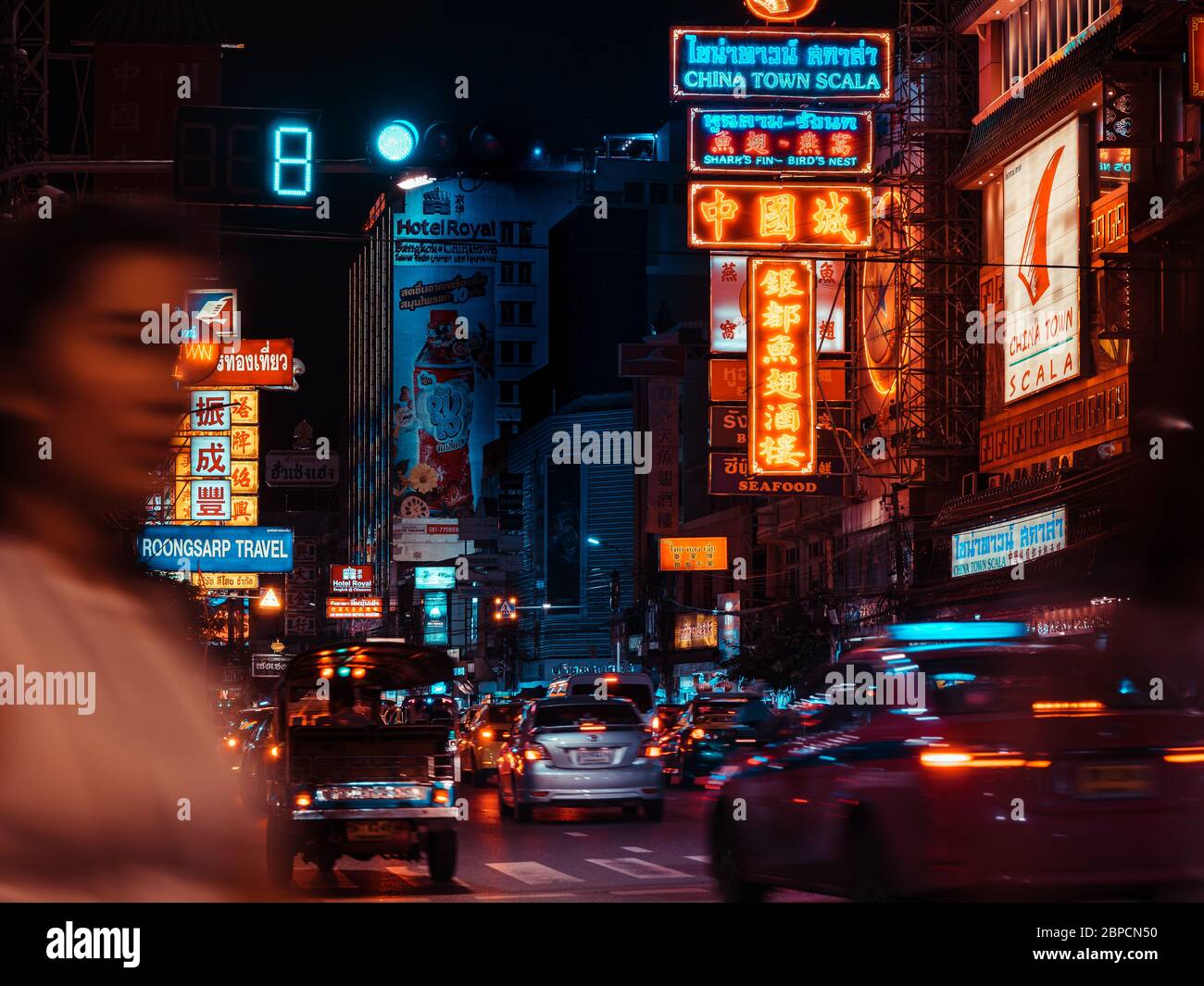 Bangkok, Thailand - April 10th, 2018 Cars and shops on Yaowarat road. Chinatown with notable ...
