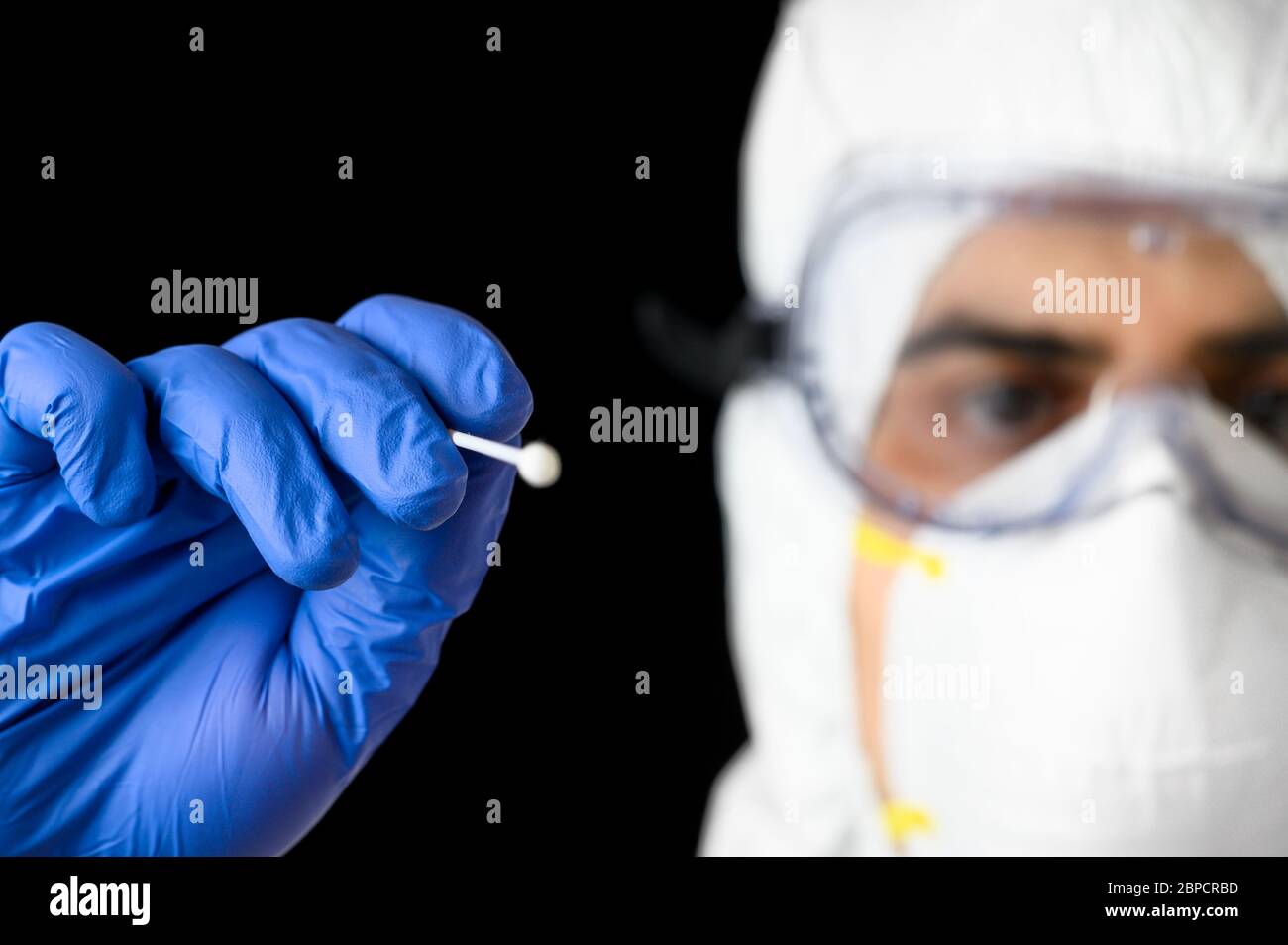 Medical healthcare technologist holding COVID-19 swab collection kit ...