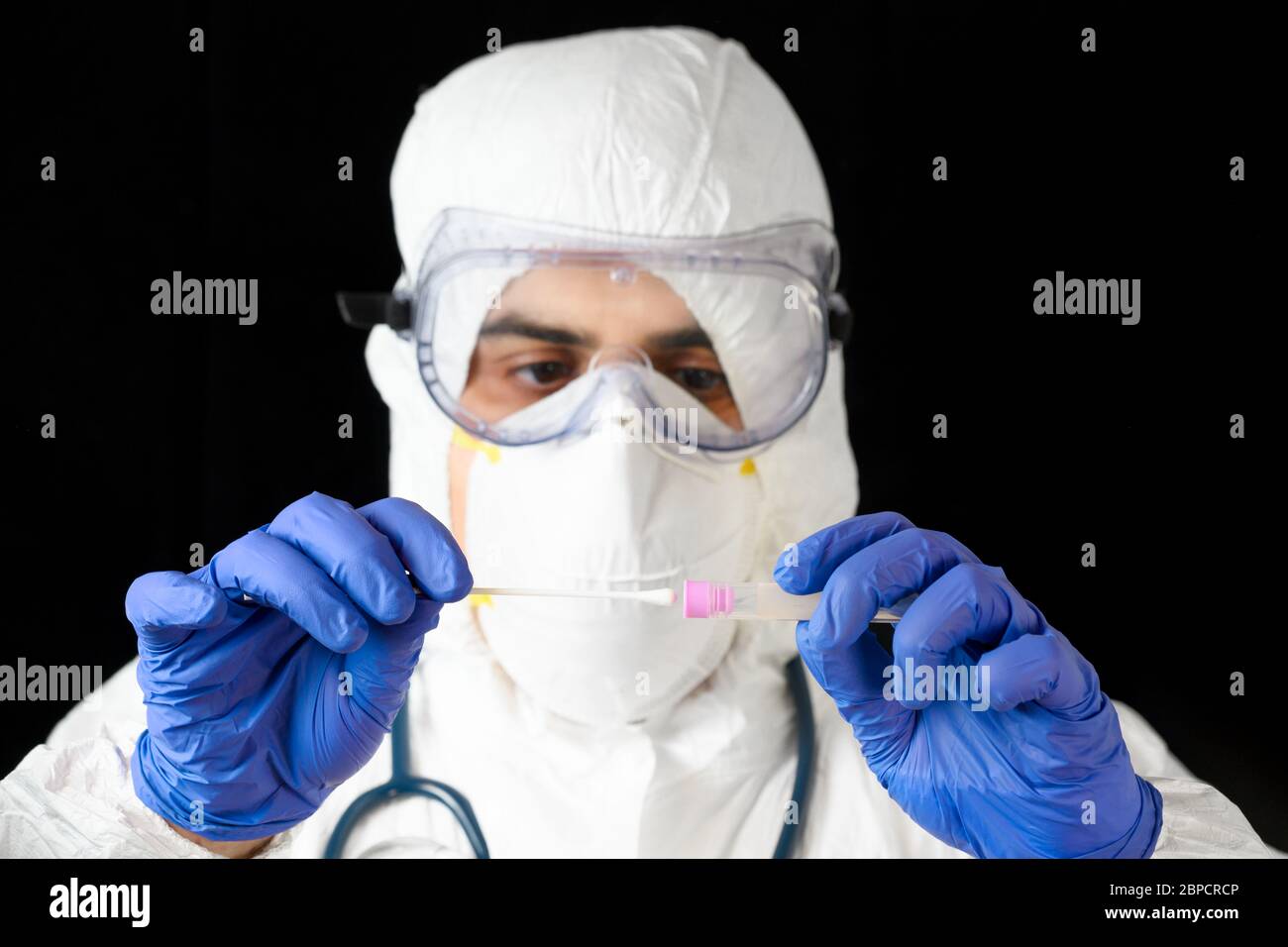 Medical healthcare technologist holding COVID-19 swab collection kit ...