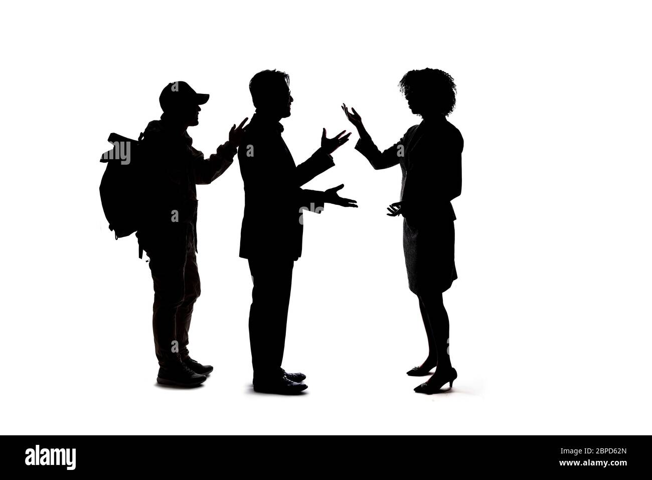 Silhouette of a group of unrecognizable people crowded together ...