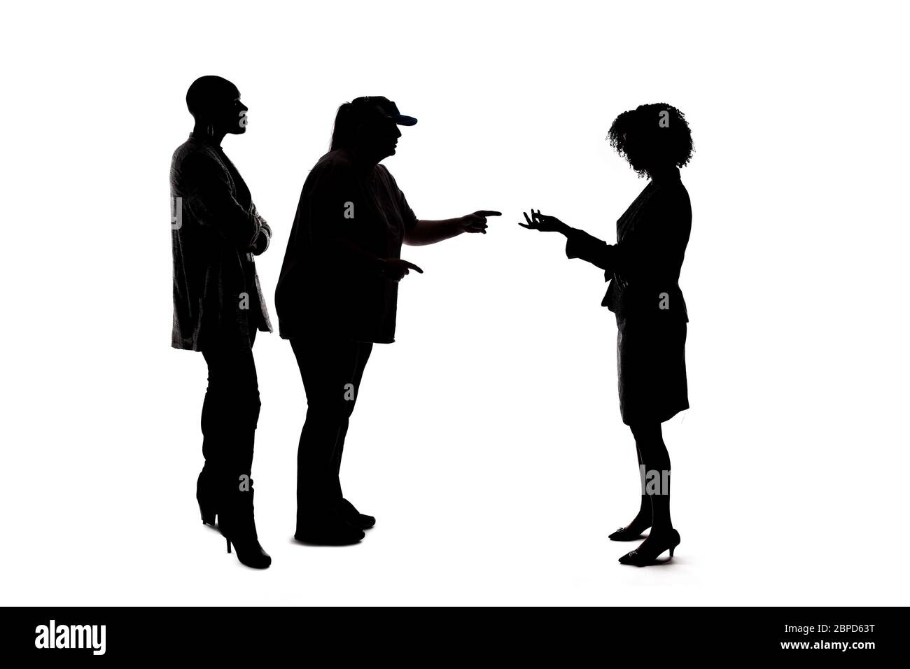 Silhouette of a group of unrecognizable people crowded together ...