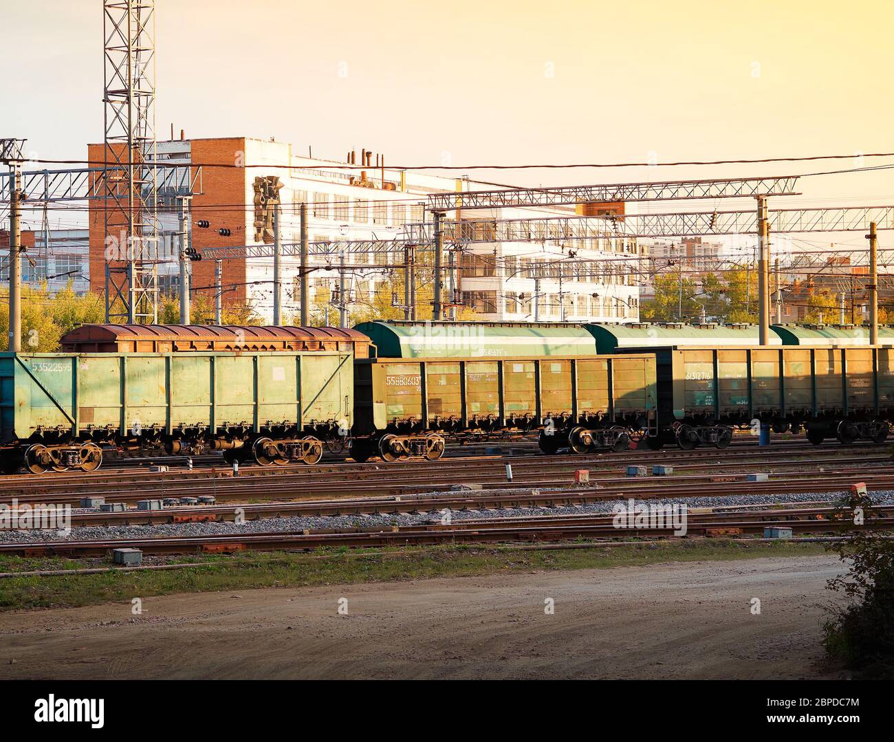 Unloading train station transport background Stock Photo - Alamy