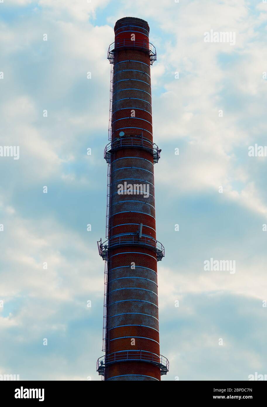 Dramatic red industrial chimney background Stock Photo - Alamy