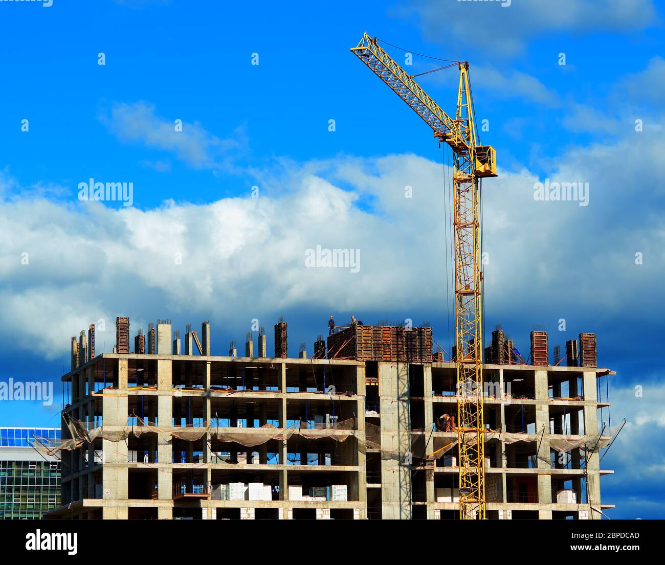 Constructing the building with the help of industrial crane ...
