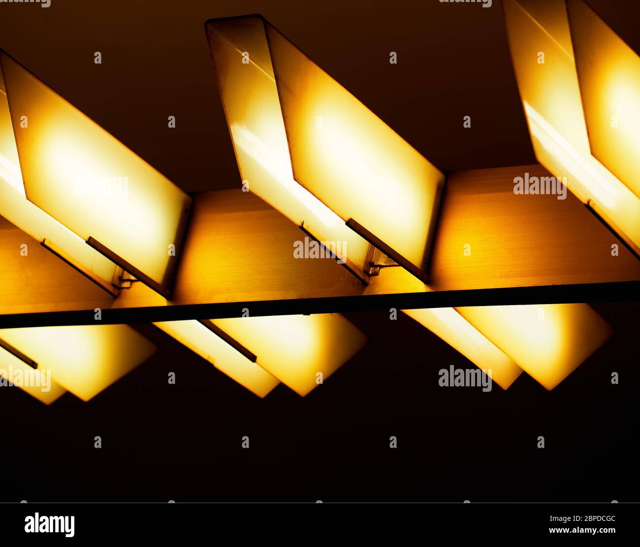 Diagonal orange lamps illumination background Stock Photo - Alamy