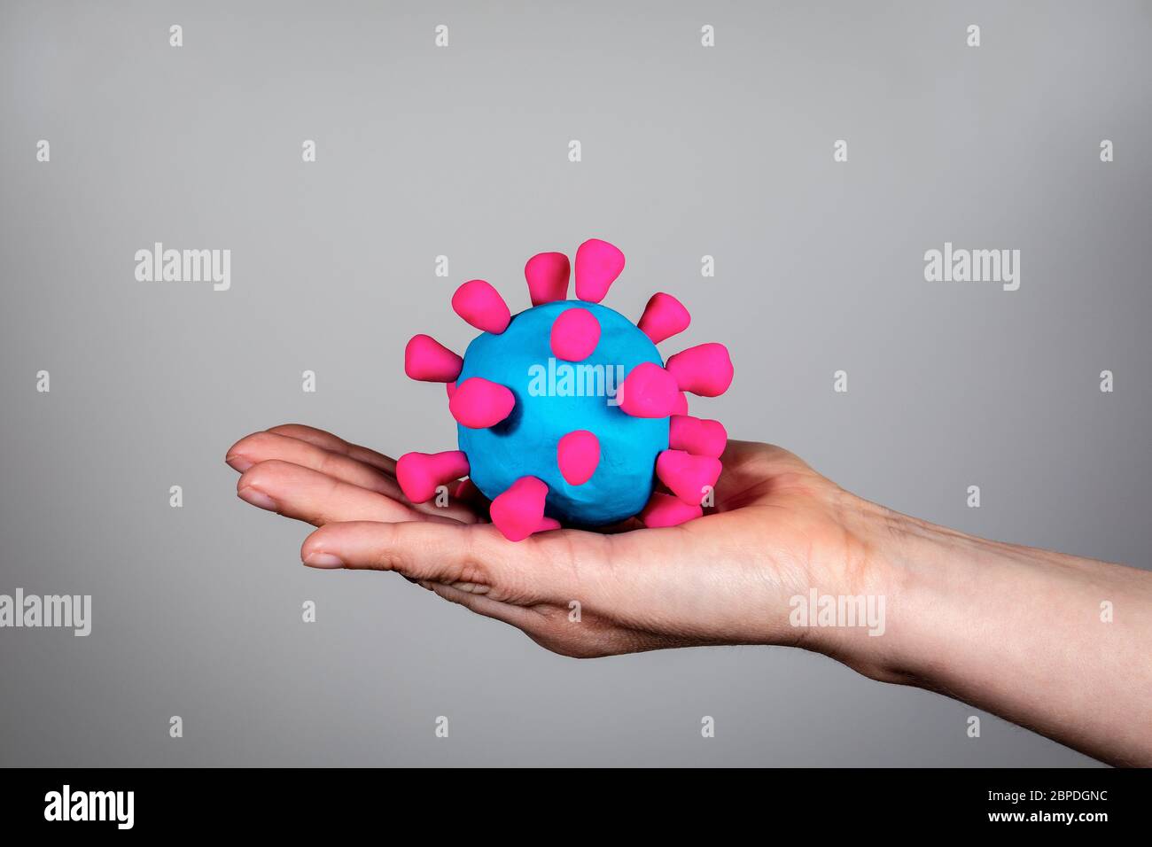 Symbolic model of coronavirus, that causes covid-19. Made from blue and ...