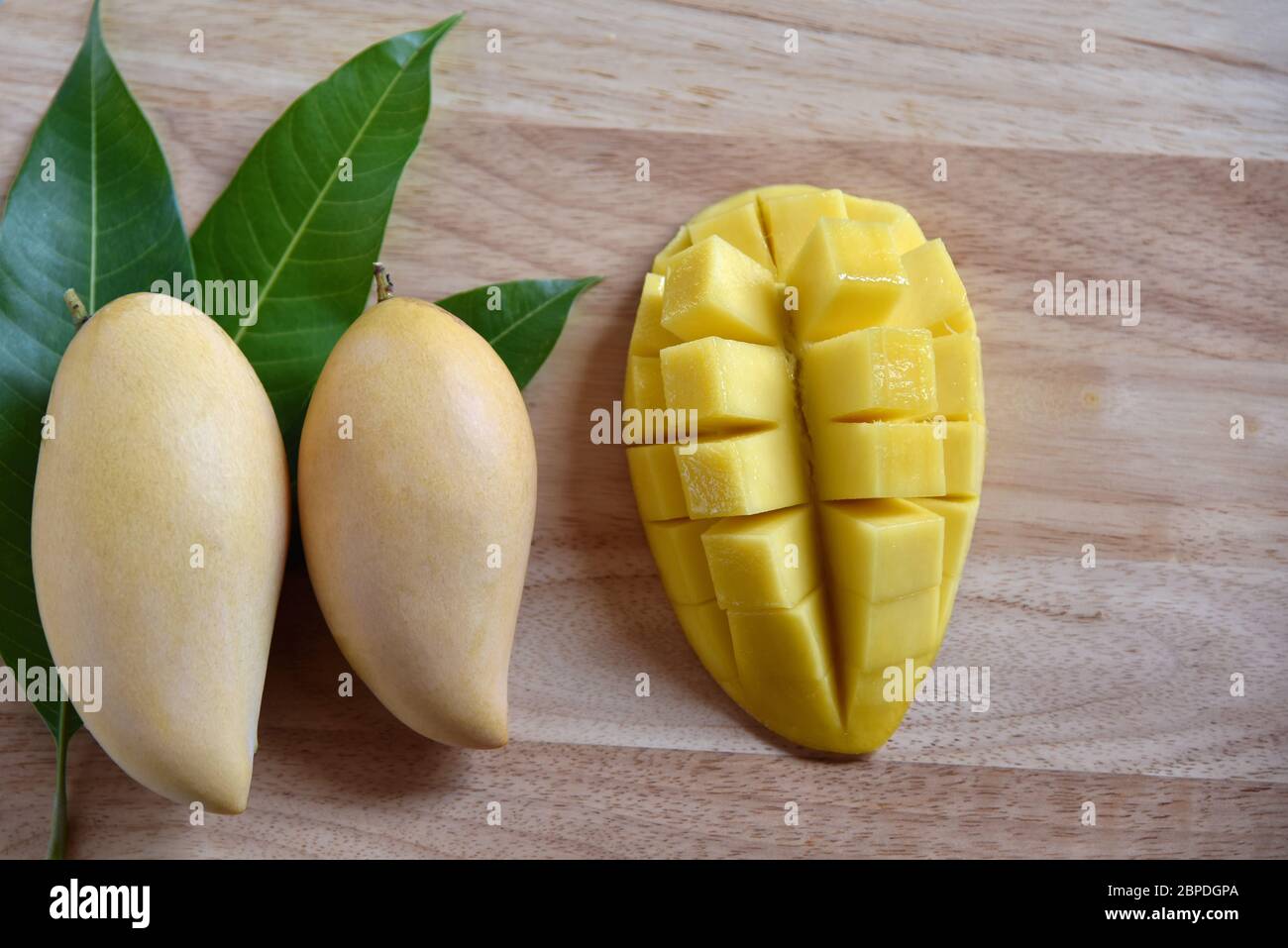 Mango. Tropical Fruits On a wooden background. Fresh beautiful mango ...