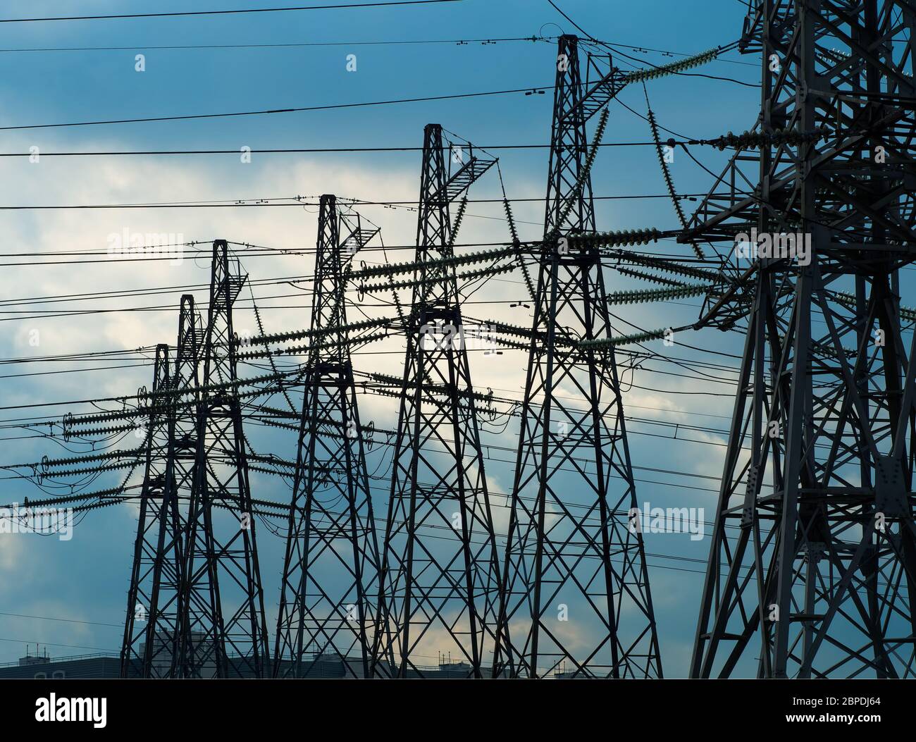 Dramatic industrial power lines background Stock Photo - Alamy