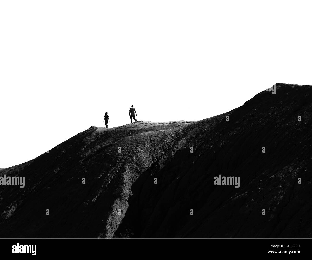 Male and female on dramatic sand slope background Stock Photo - Alamy