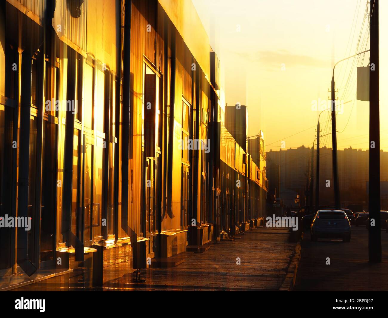 Dramatic sunset on evening street city background Stock Photo - Alamy