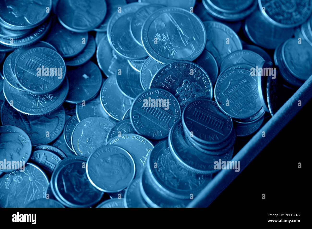 Paper box with a bunch of American cents close up. Money background ...