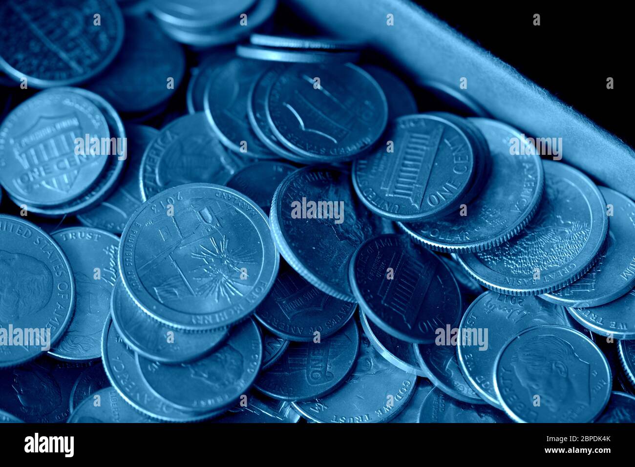 Paper box with a bunch of American cents close up. Money background ...