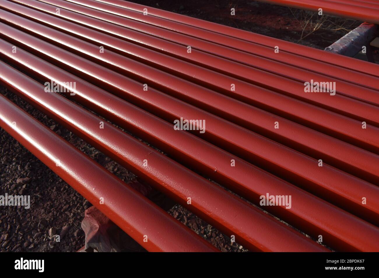red pipes in the paintshop. fire water lines in the industrial ...