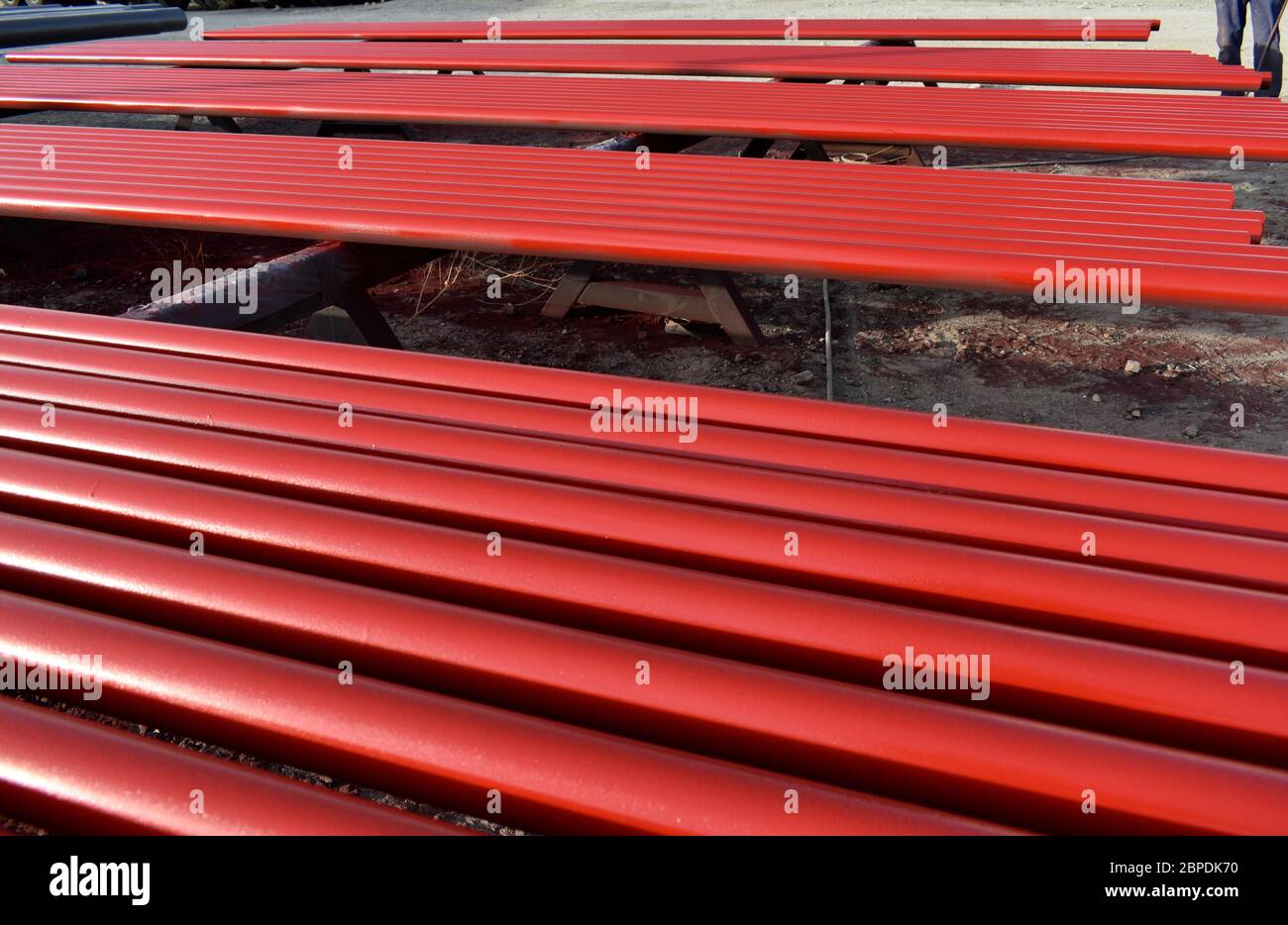 red pipes in the paintshop. fire water lines in the industrial ...