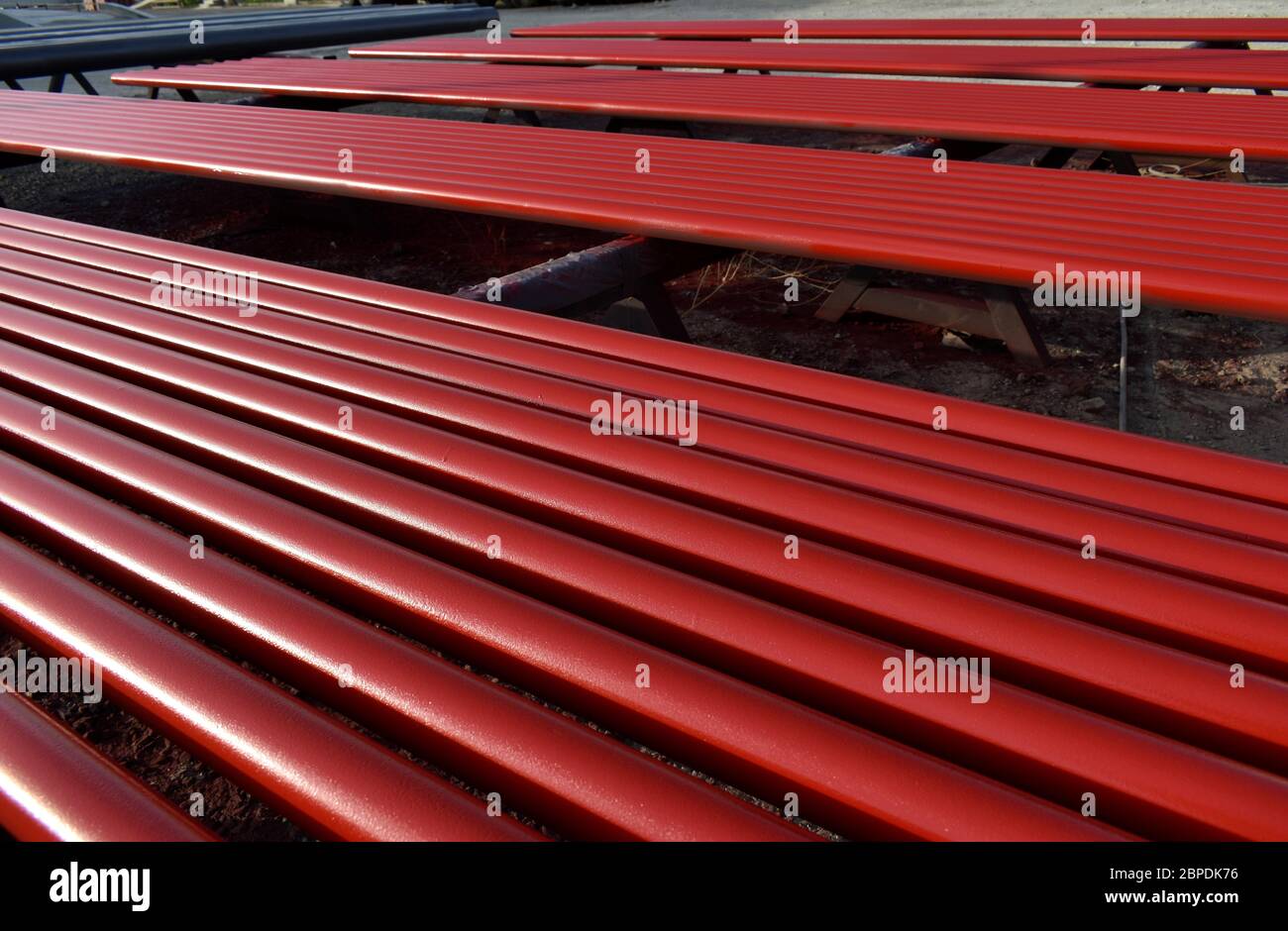 red pipes in the paintshop. fire water lines in the industrial ...