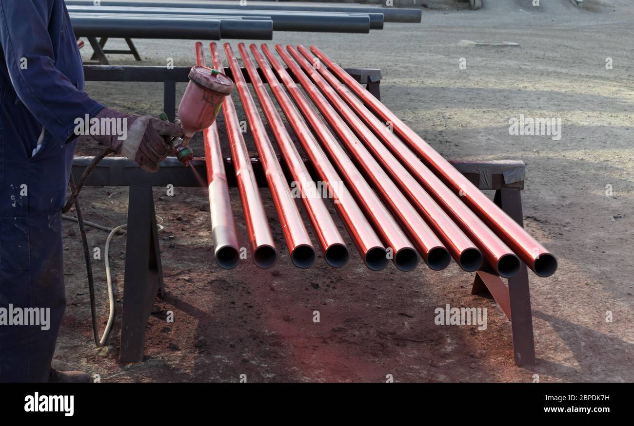 red pipes in the paintshop. fire water lines in the industrial ...