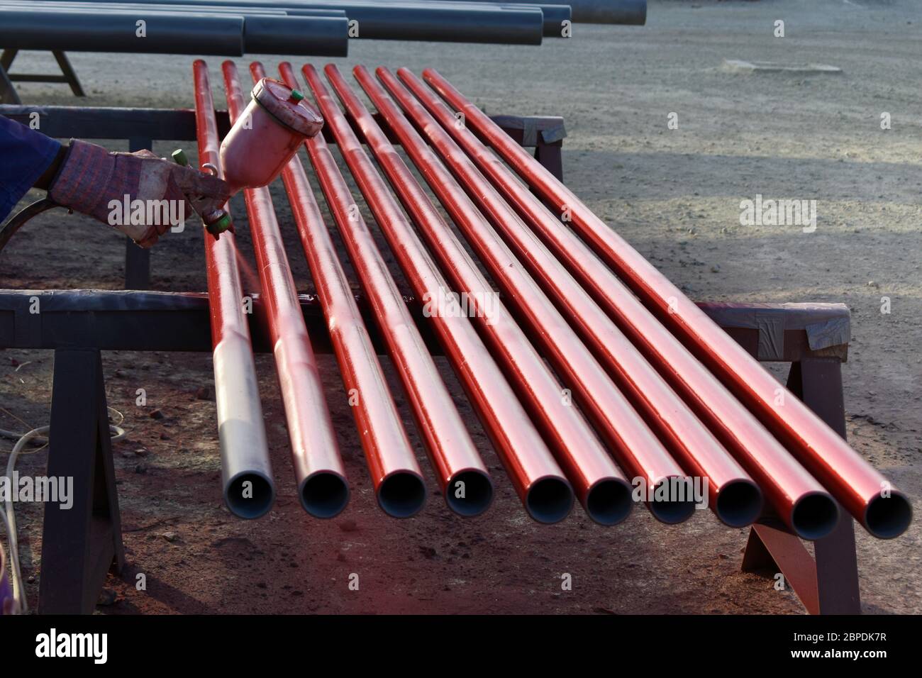 red pipes in the paintshop. fire water lines in the industrial ...