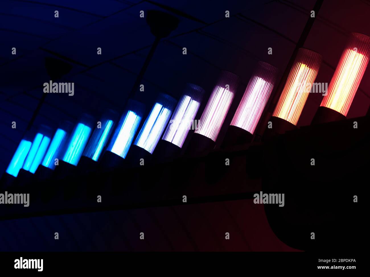 Diagonal colorful lamps at night club background Stock Photo - Alamy