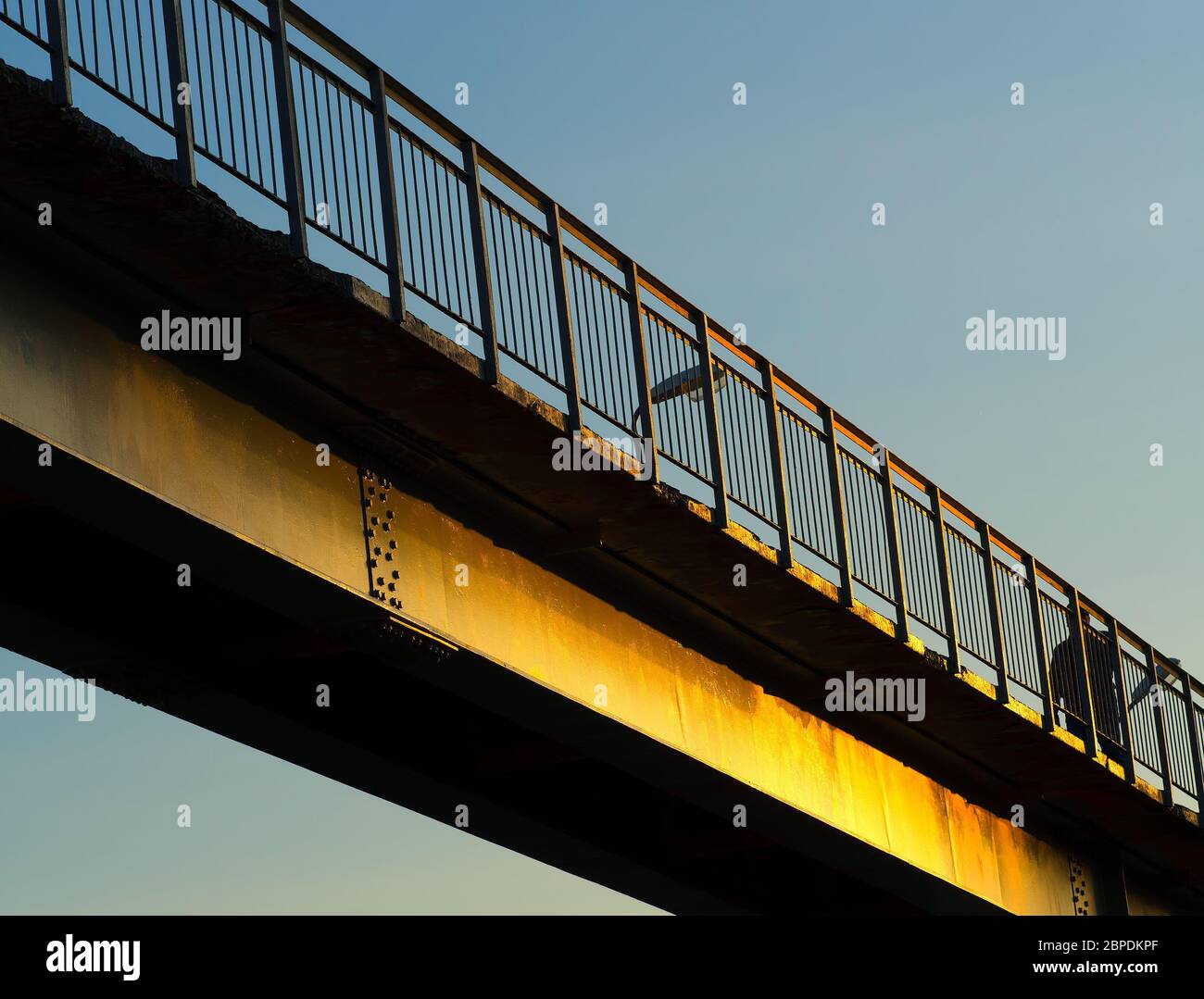 Dramatic diagonal bridge during sunset background Stock Photo - Alamy
