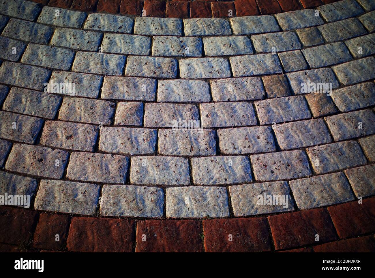 Curved path from concrete tiles texture background Stock Photo - Alamy