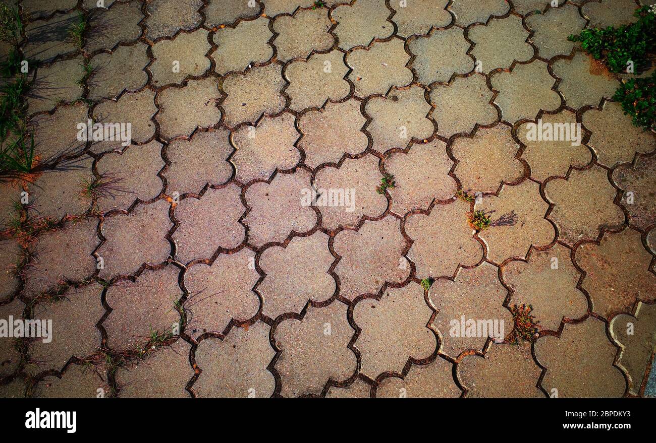 Diagonal concrete tiles city pavement background Stock Photo - Alamy