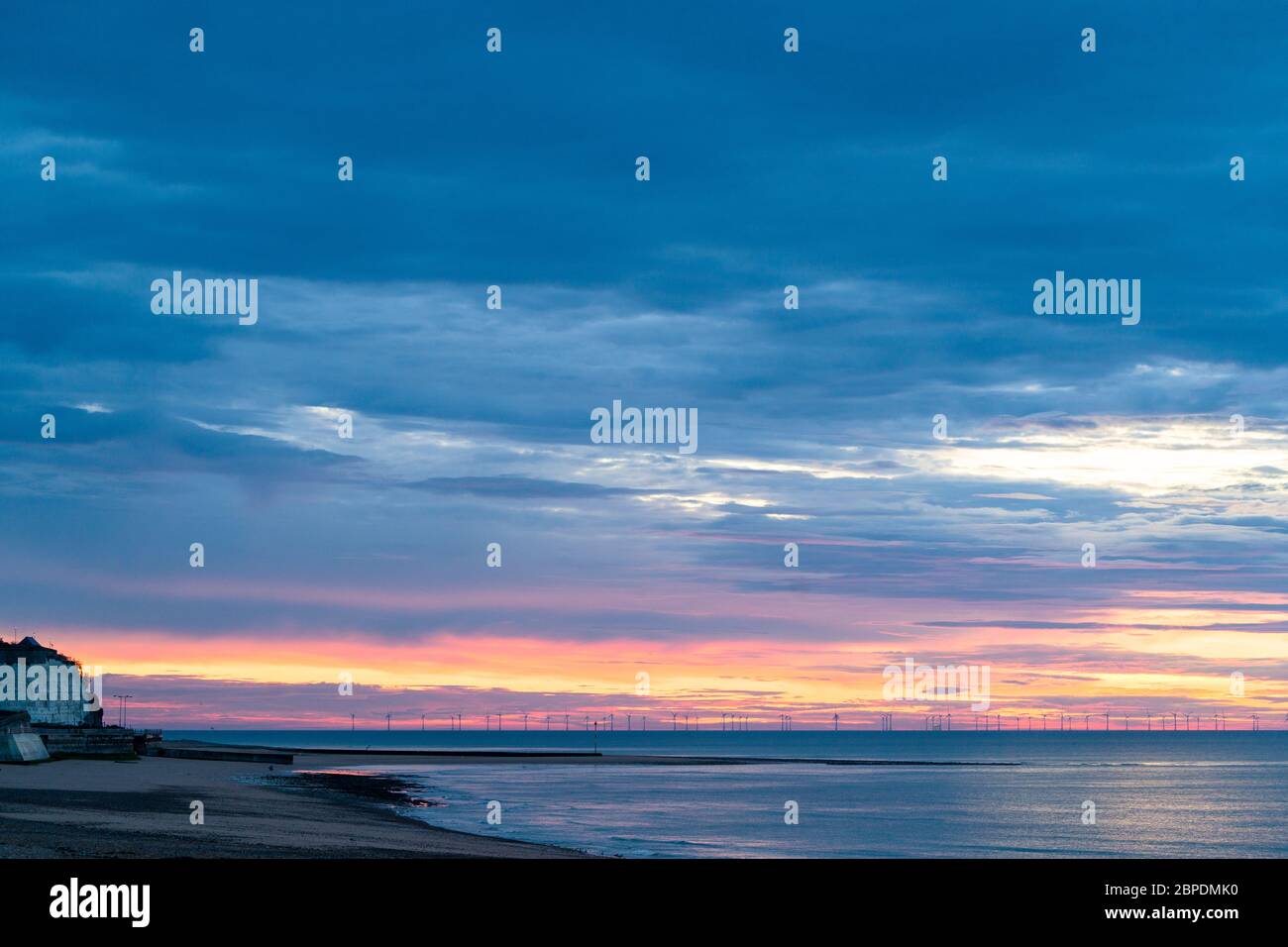 The dawn sky over the Thanet offshore wind farm off the Kent coast in ...