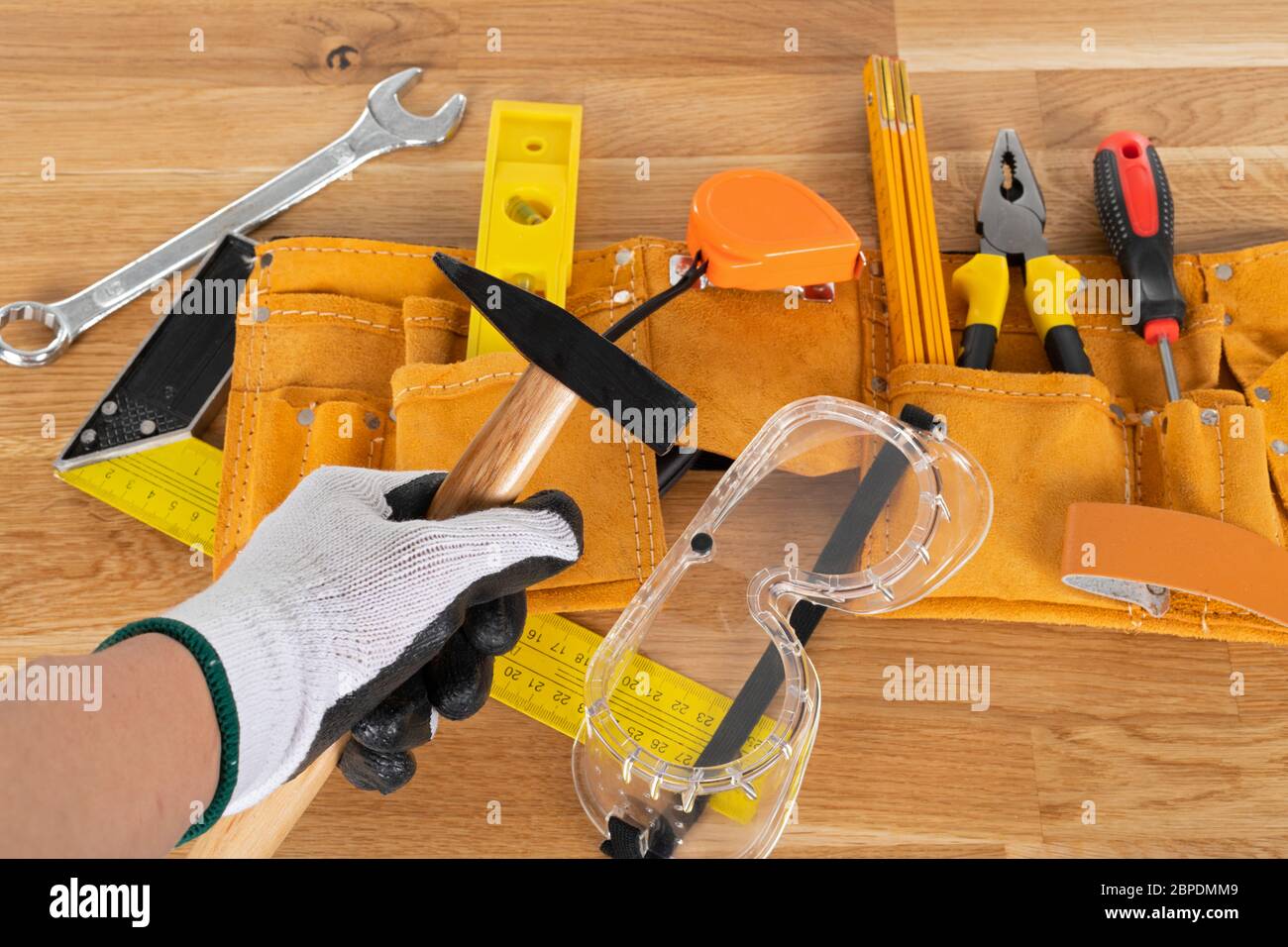 Picture of construction equipment and tools on wooden background, top ...