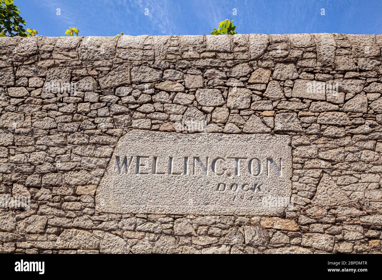 Sign on the old stone wall of the Wellington Dock, part of the Port of ...