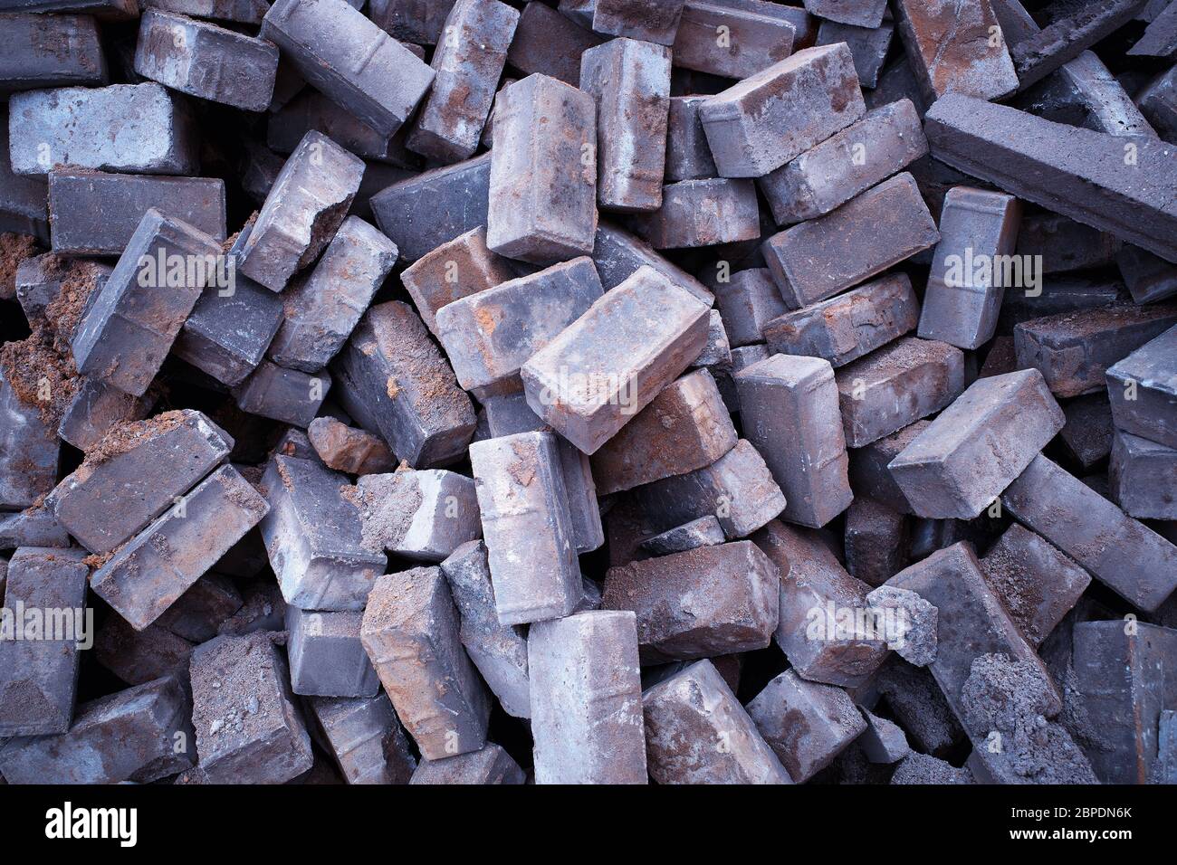 Concrete street block in heap background Stock Photo - Alamy