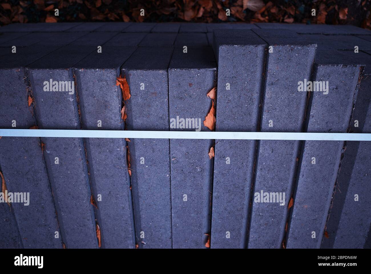 Packed blocks for road pavement construction background Stock Photo - Alamy