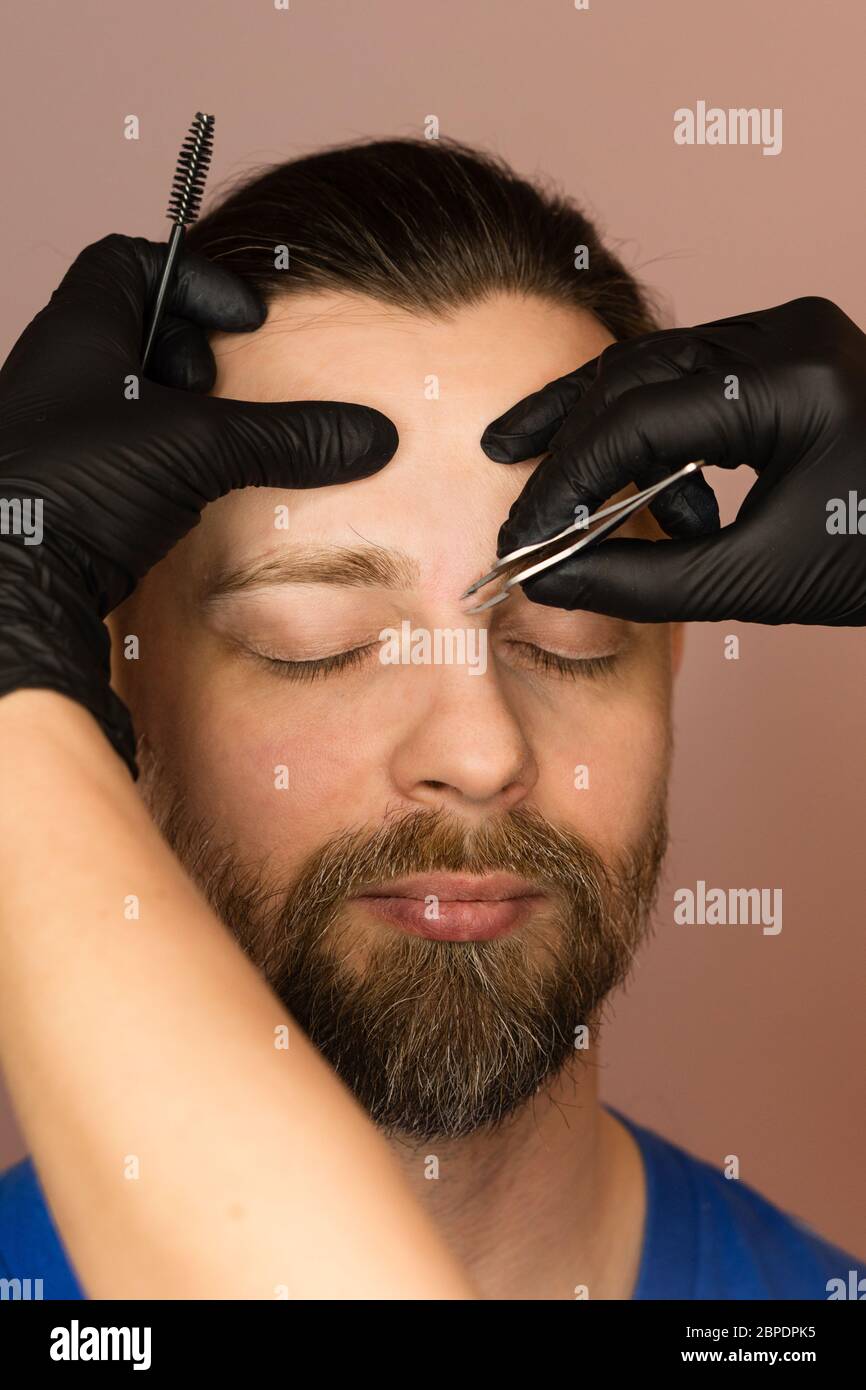 Eyebrow threading men hi-res stock photography and images - Alamy
